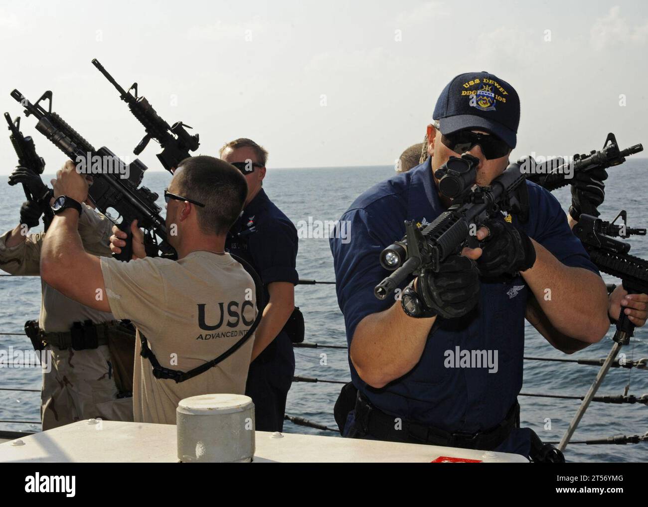US Navy A Sailor forms a security bubble with other Sailors during ...