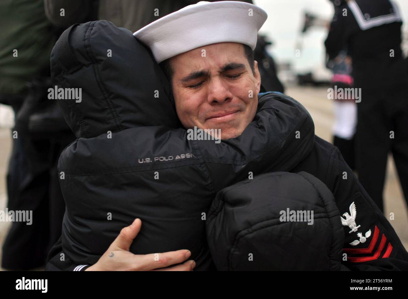 US Navy A Sailor hugs his son following the ship's return to Naval ...