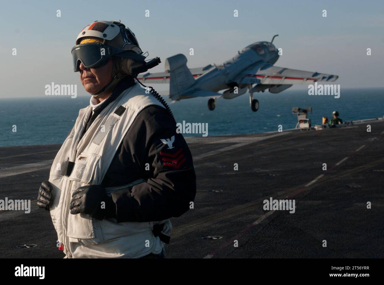 US Navy A Sailor observes flight operations.jpg Stock Photo - Alamy
