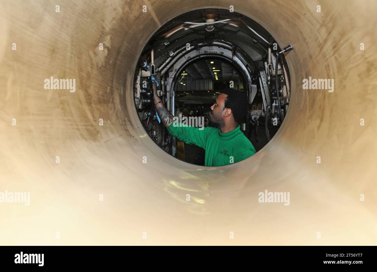 US Navy A Sailor performs corrosion prevention maintenance on the ...