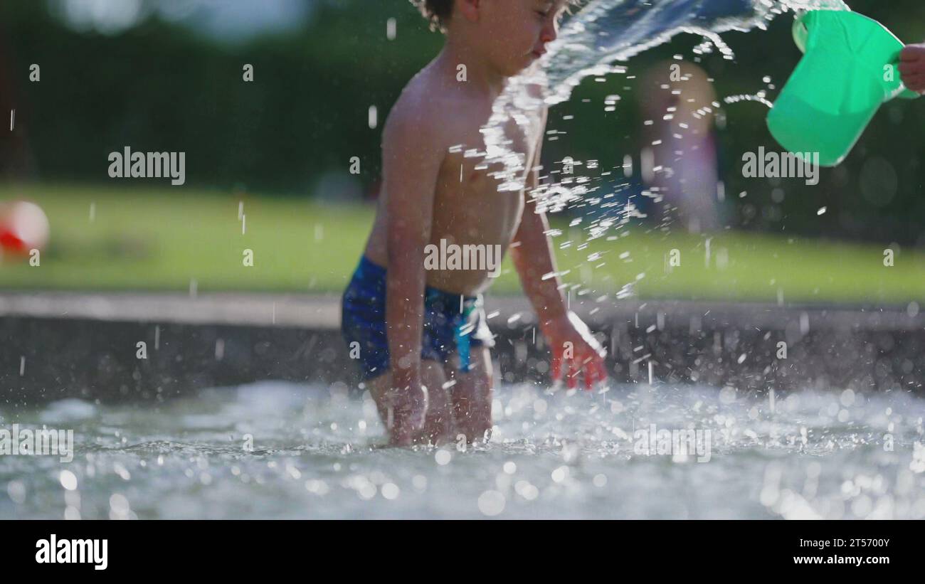Splashing little boy with bucket of water in 120 fps slow-motion at ...