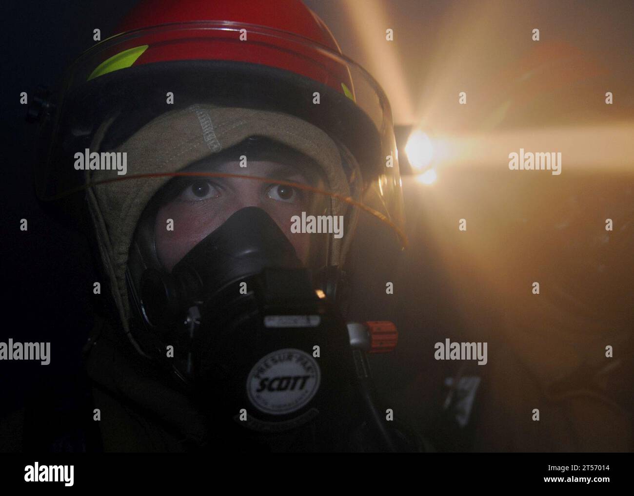 US Navy A Sailor practices firefighting during a general quarters drill ...