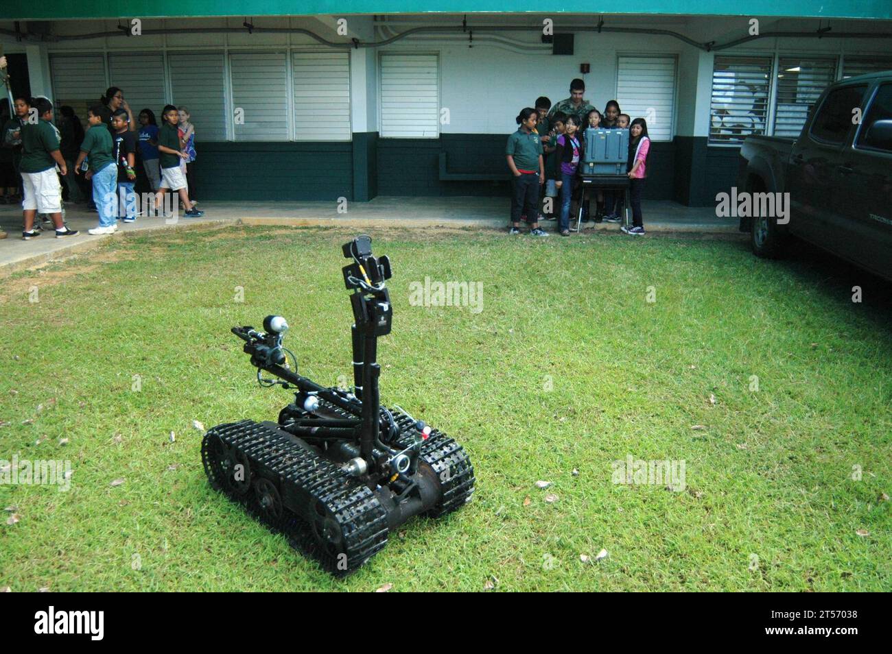 US Navy A Sailor shows an elementary school student class how to ...
