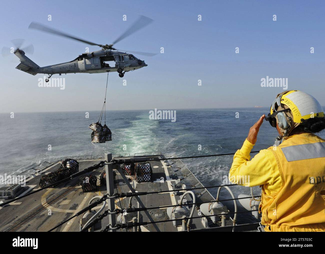 US Navy A Sailor signals a helicopter.jpg Stock Photo - Alamy
