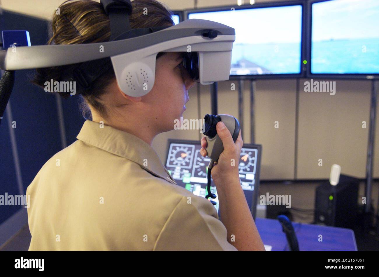 US Navy A Surface Warfare Officer's School (SWOS) student navigates a ...