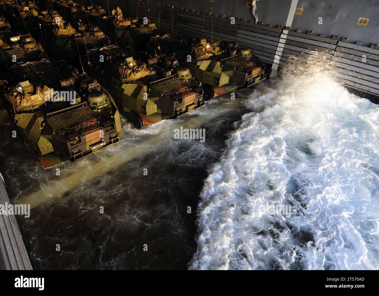 US Navy A wave rolls into the well deck of the forward-deployed ...