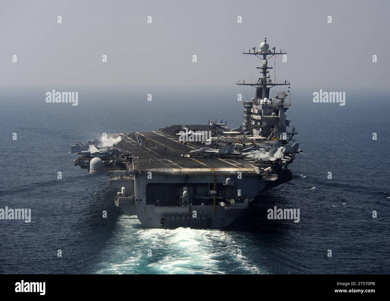 US Navy Aircraft prepare to launch aboard the aircraft carrier USS John ...