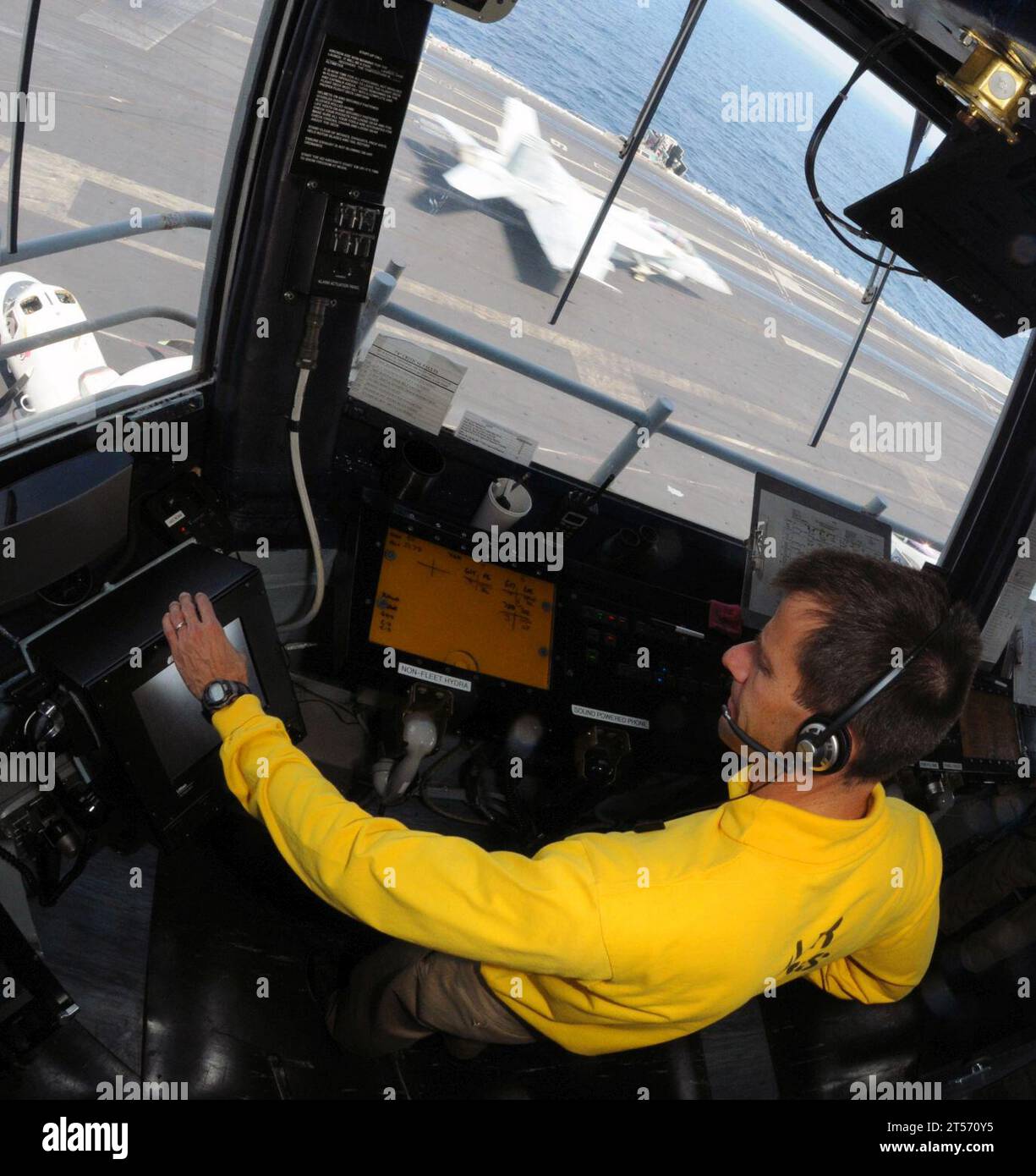US Navy An air officer oversees an aircraft recovery from primary ...