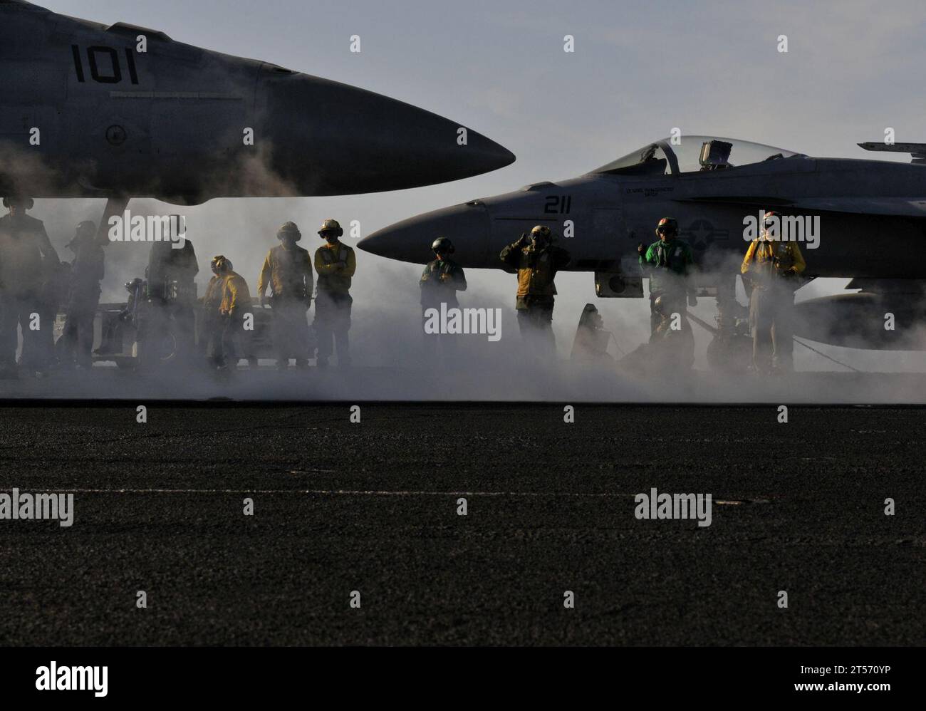 US Navy An aircraft director guides an F18F Super Hornet into position ...