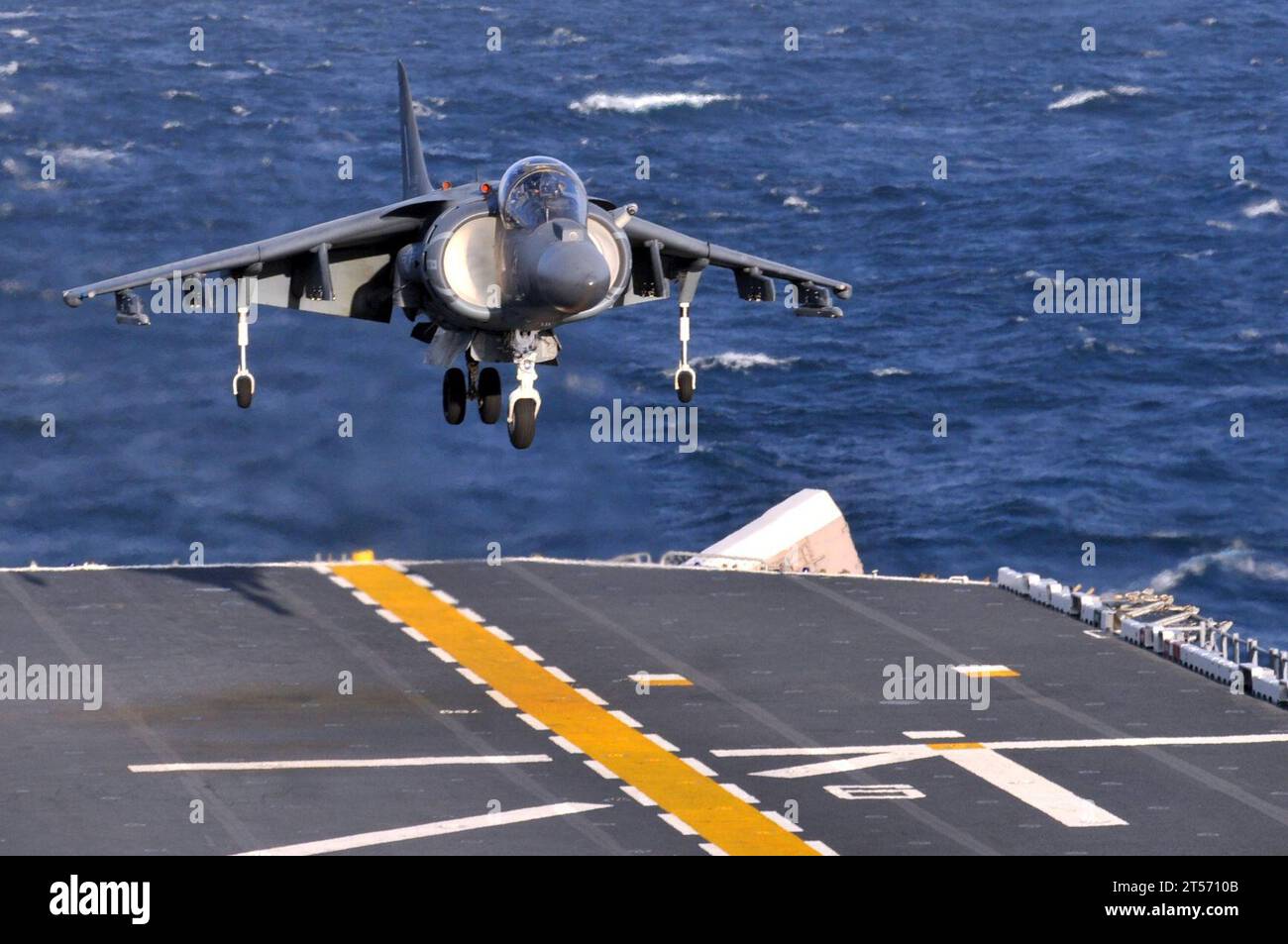 US Navy An AV-8B Harrier performs a vertical landing on the flight deck ...