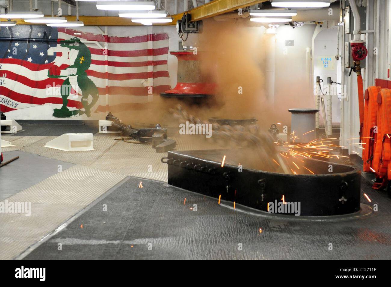US Navy An anchor chain runs through the hawse pipe aboard the multi ...