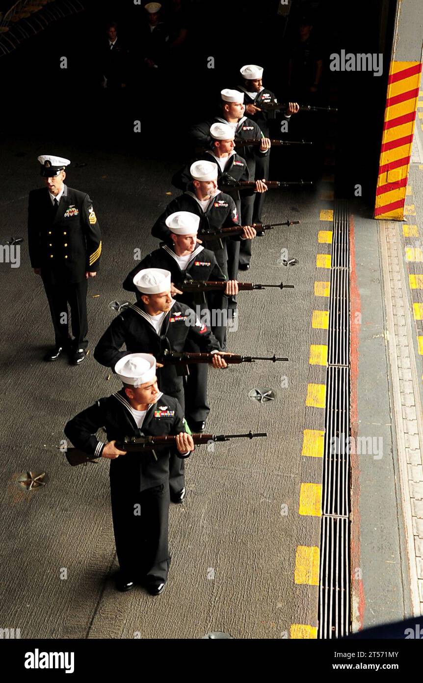 US Navy An honor detail conducts a rifle volley during a memorial ...