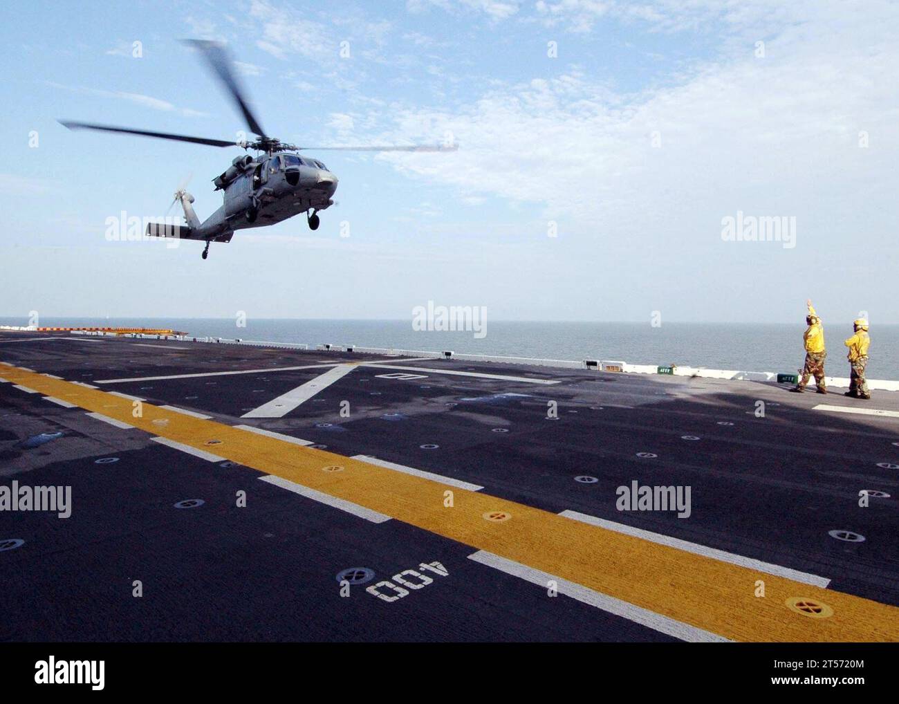 US Navy An MH-60S Sea Hawk helicopter lifts off from the amphibious ...