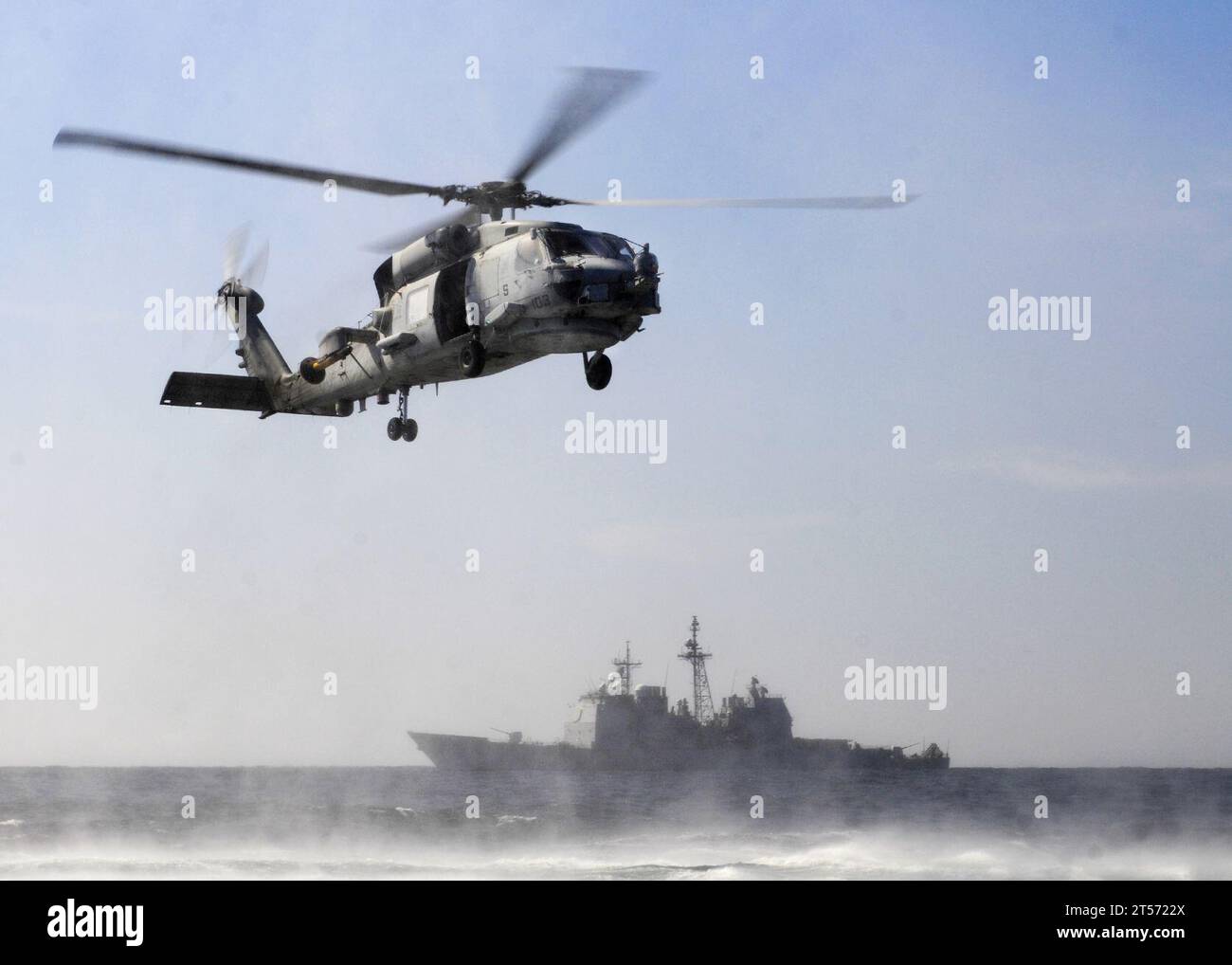 US Navy An SH-60B Sea Hawk helicopter hovers above the water during ...