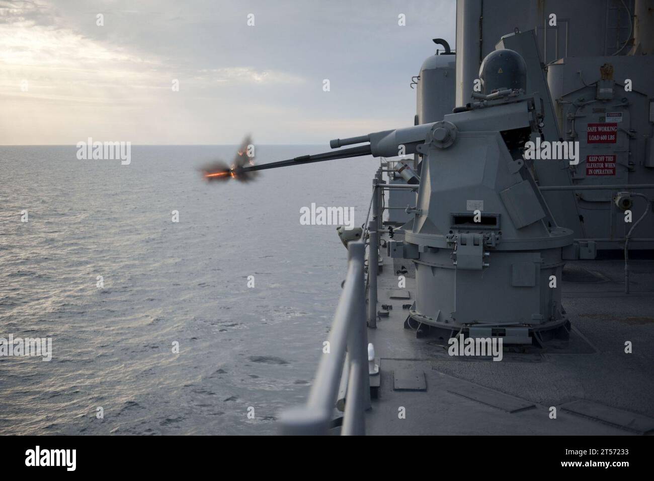 US Navy An MK38 MOD 2 25mm machine gun system aboard the amphibious ...