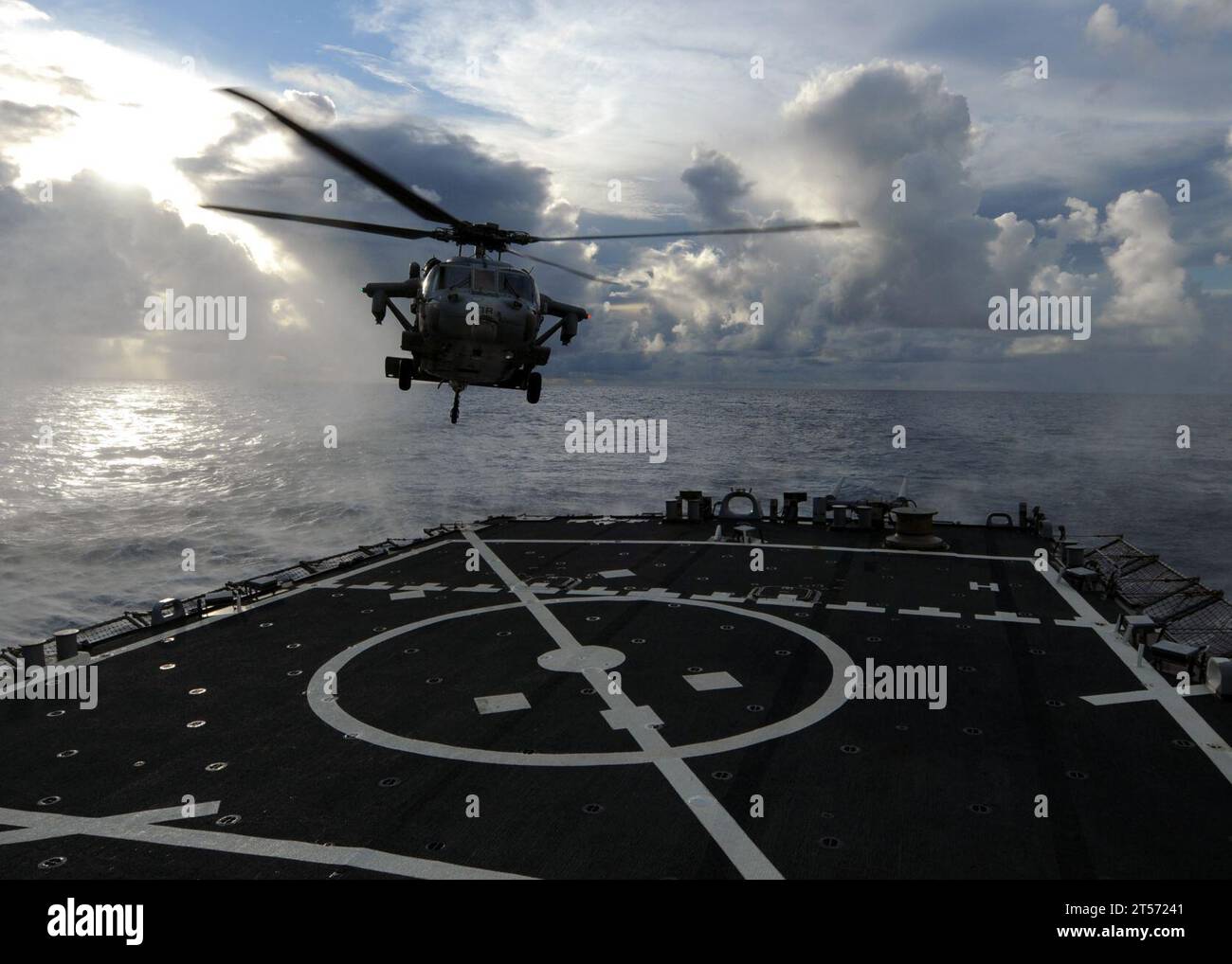 US Navy An SH-60 Sea Hawk helicopter lands on the flight deck of the ...