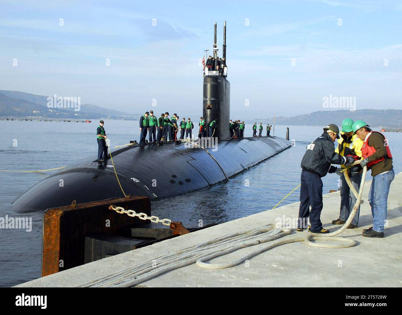 US Navy assist with mooring operations as the Los Angeles-class nuclear ...