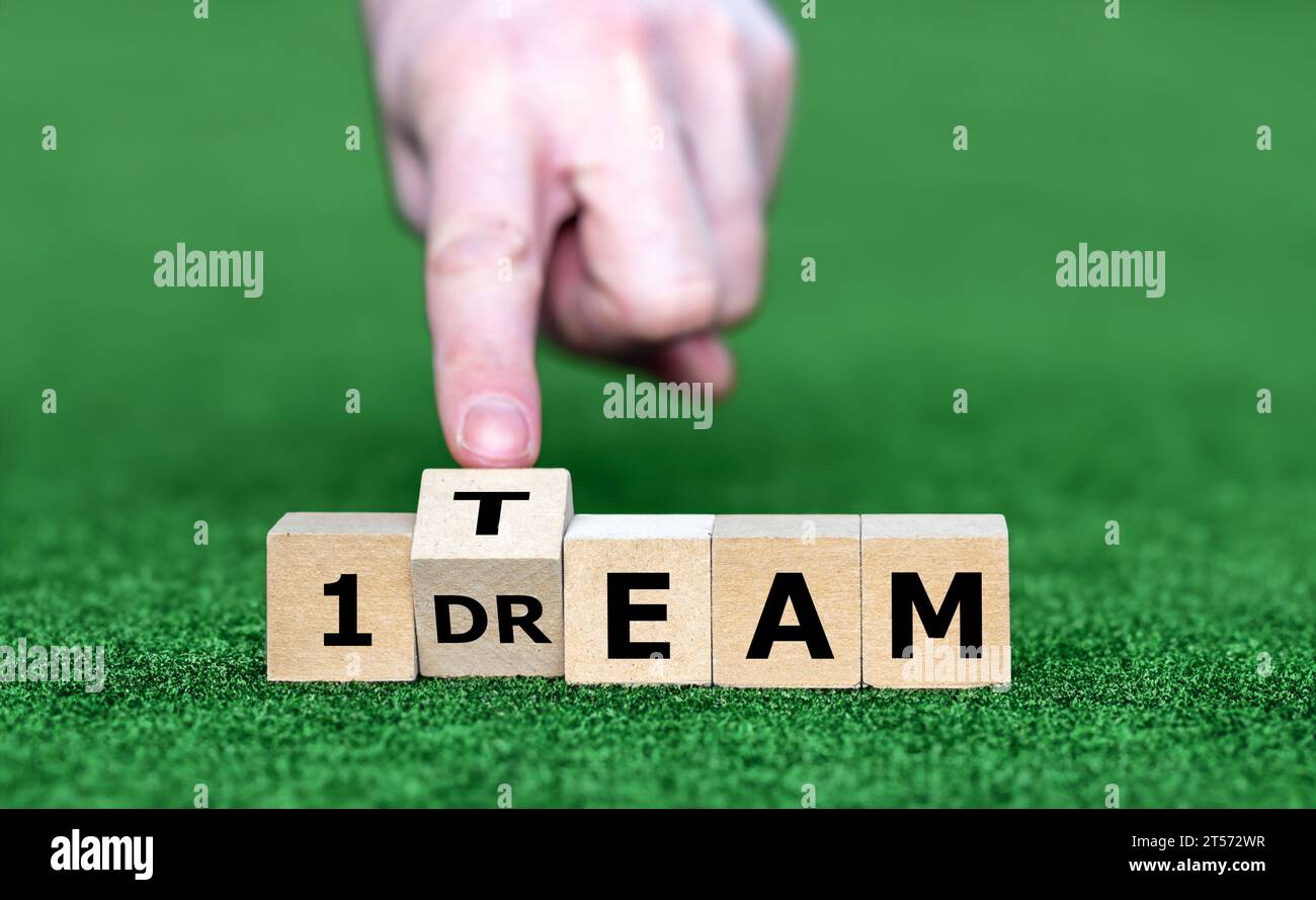Cubes form the expression 'one dream, one team' Stock Photo - Alamy
