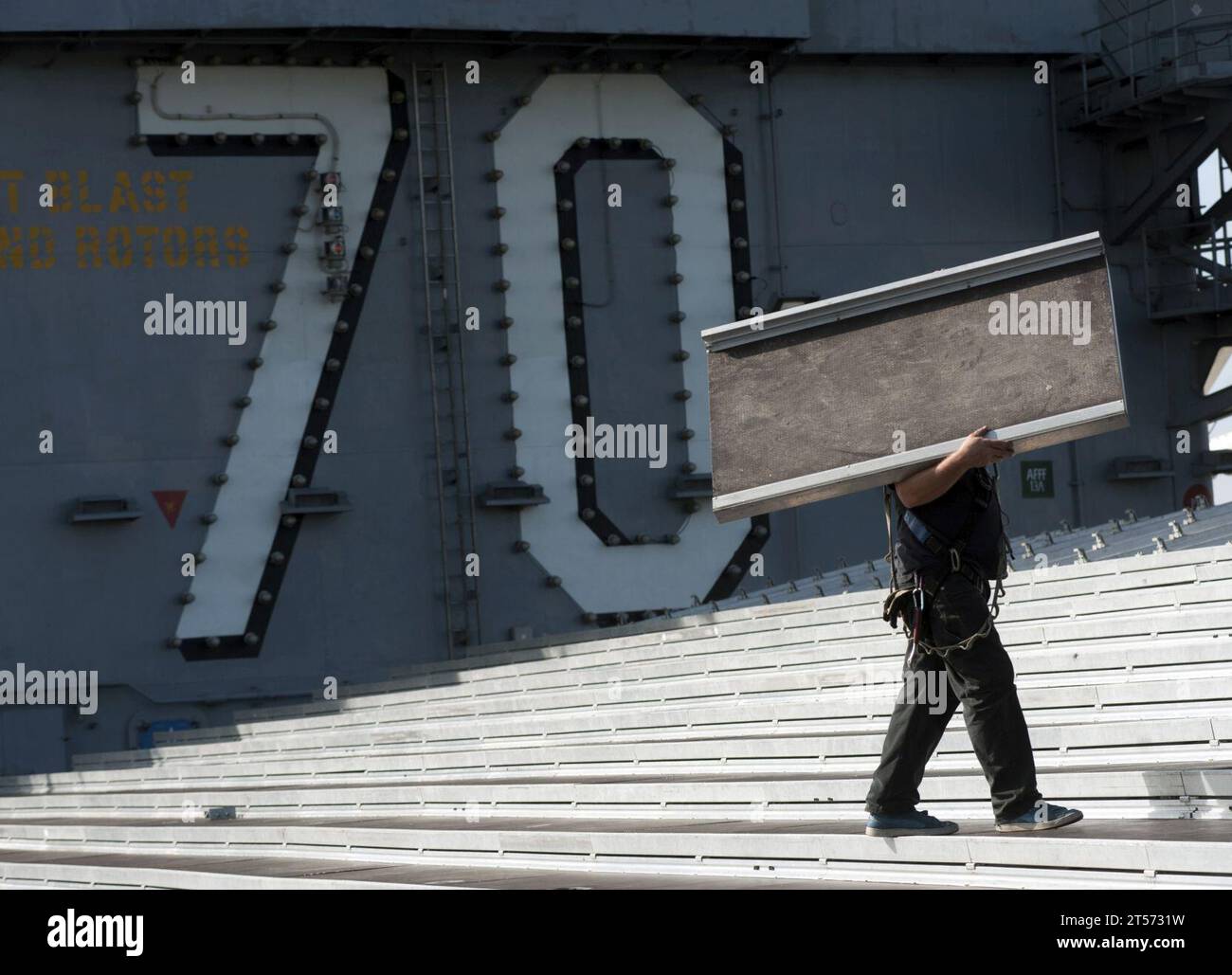 US Navy Civilian contractors assemble bleachers while building a ...