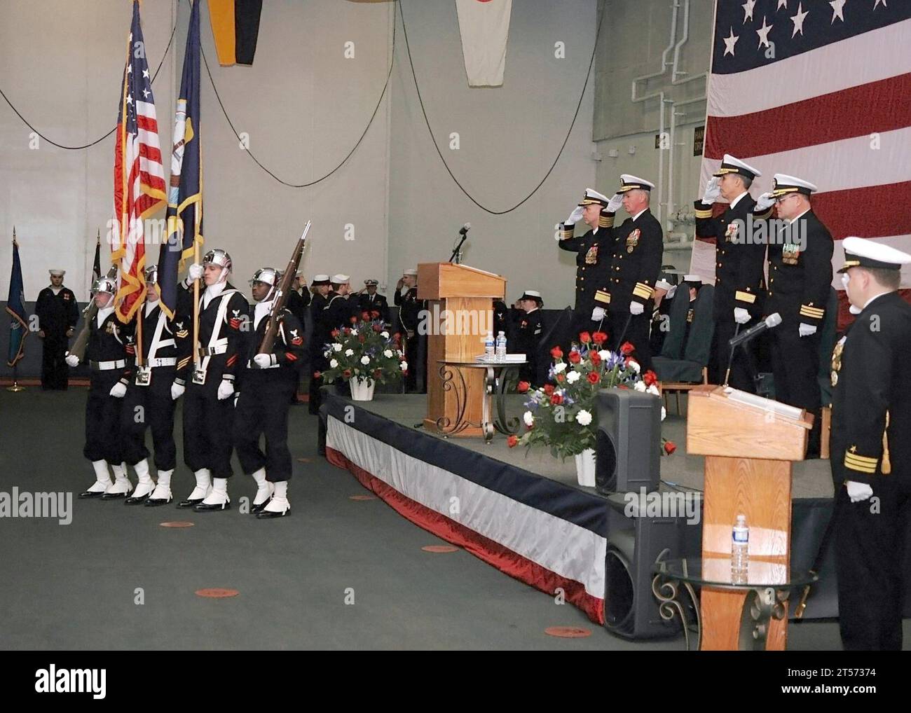 US Navy Color guard parades the colors during a change of command ceremony for Carrier Strike ...