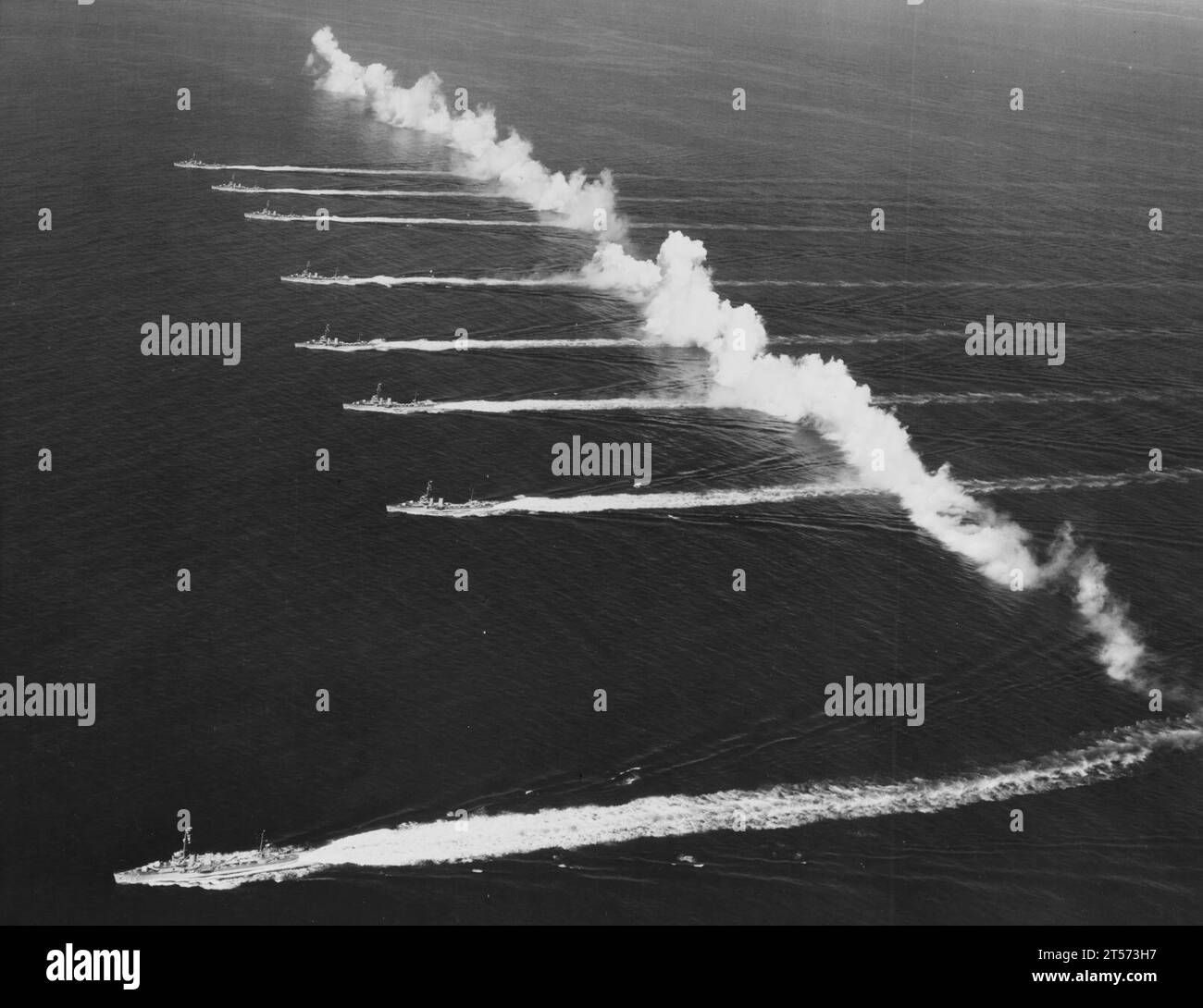 US Navy Destroyer Squadron 20 steams through a smokescreen off San ...