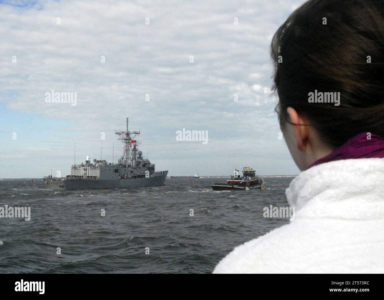 US Navy Family members watch as the guided-missile frigate USS Nicholas ...