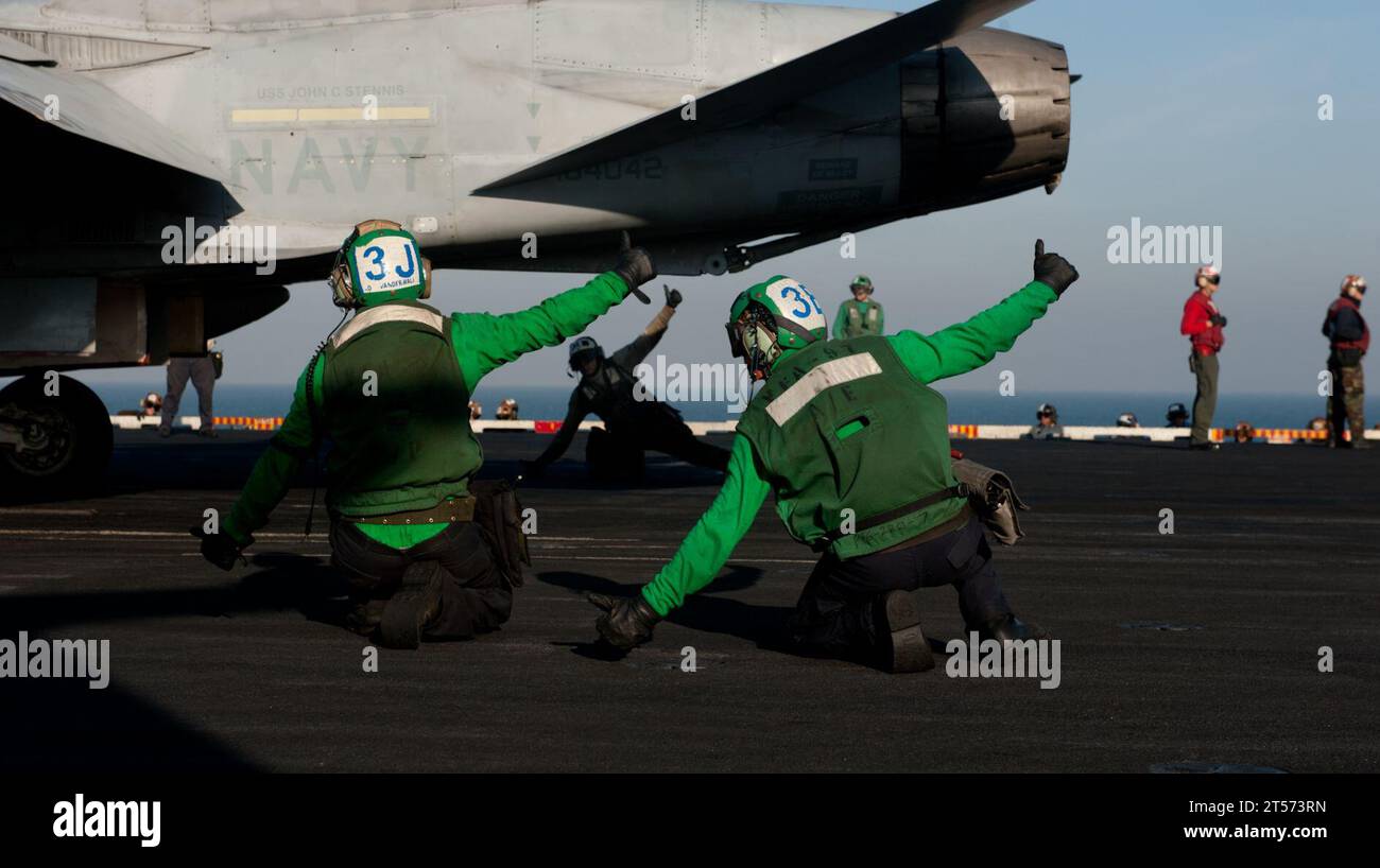 US Navy Final checkers give the safe for launching signal to the jet ...