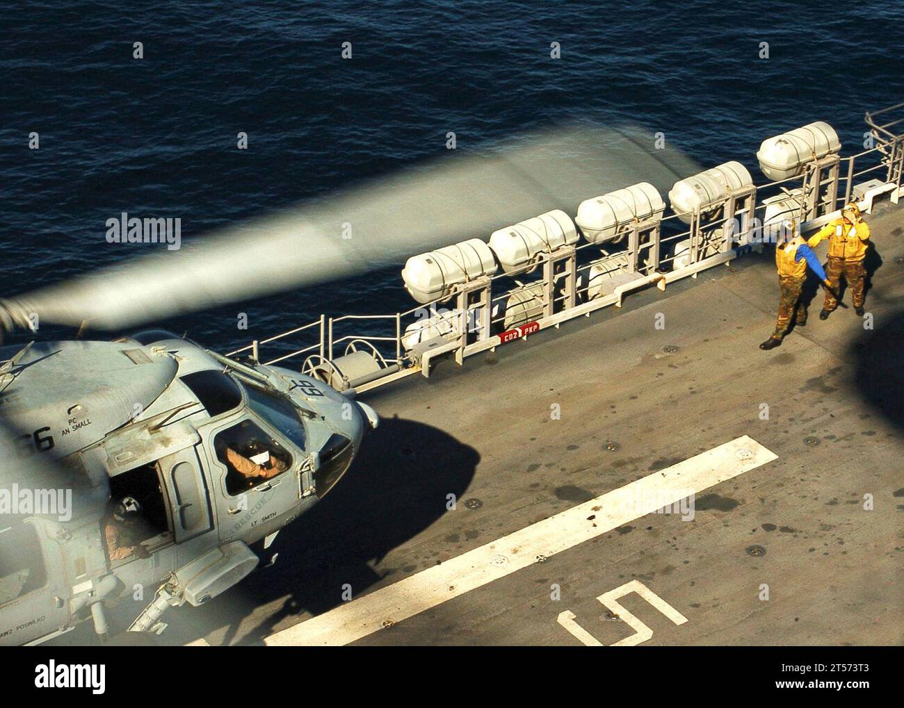 US Navy Flight deck crewmen aboard the amphibious assault ship USS ...