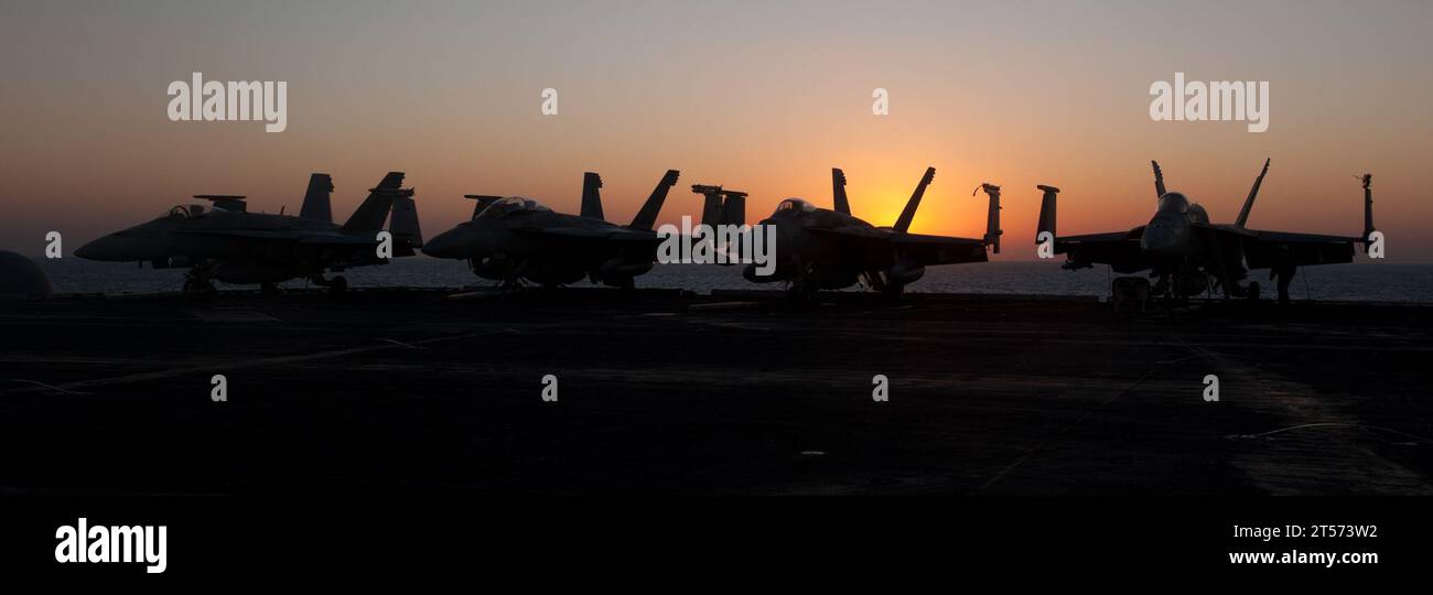 US Navy Fixed-wing aircraft are chalked and chained aboard the Nimitz ...