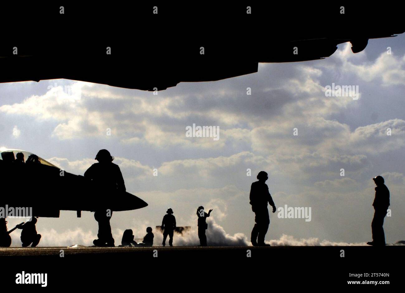 US Navy Flight deck personnel prepare for a launch from the flight deck ...