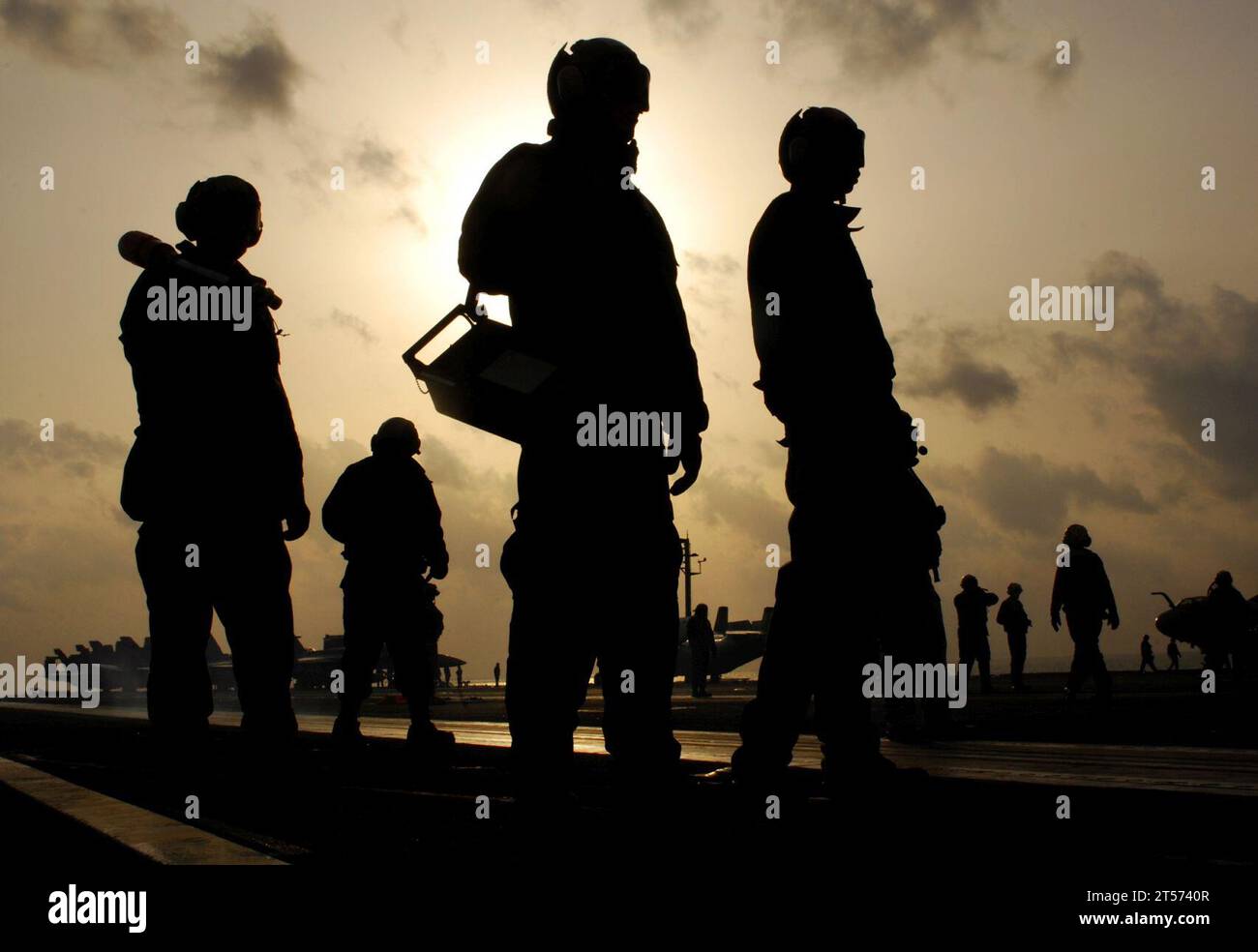 US Navy Flight deck personnel prepare for aircraft launches on the ...