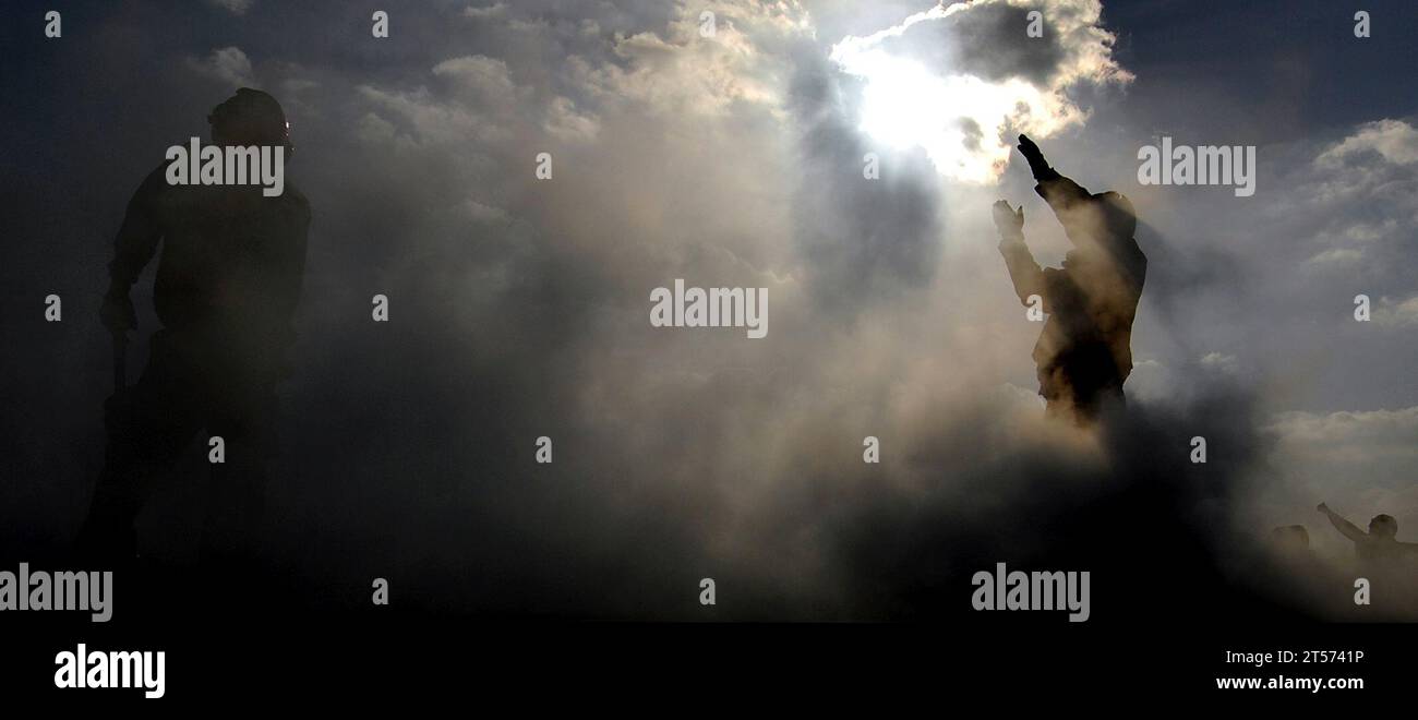 US Navy Flight deck personnel prepare for a launch from the flight deck ...