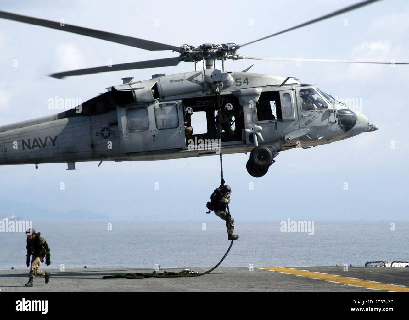 US Navy French boarding teams rappel out of a U.S. Navy SH-60 Seahawk ...