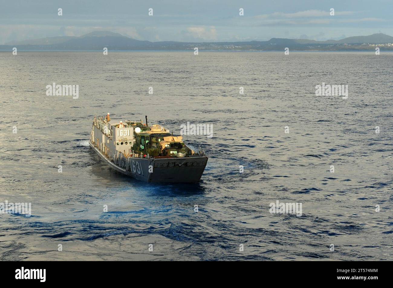 US Navy Landing Craft Utility (LCU) 1631 departs the well deck of the ...