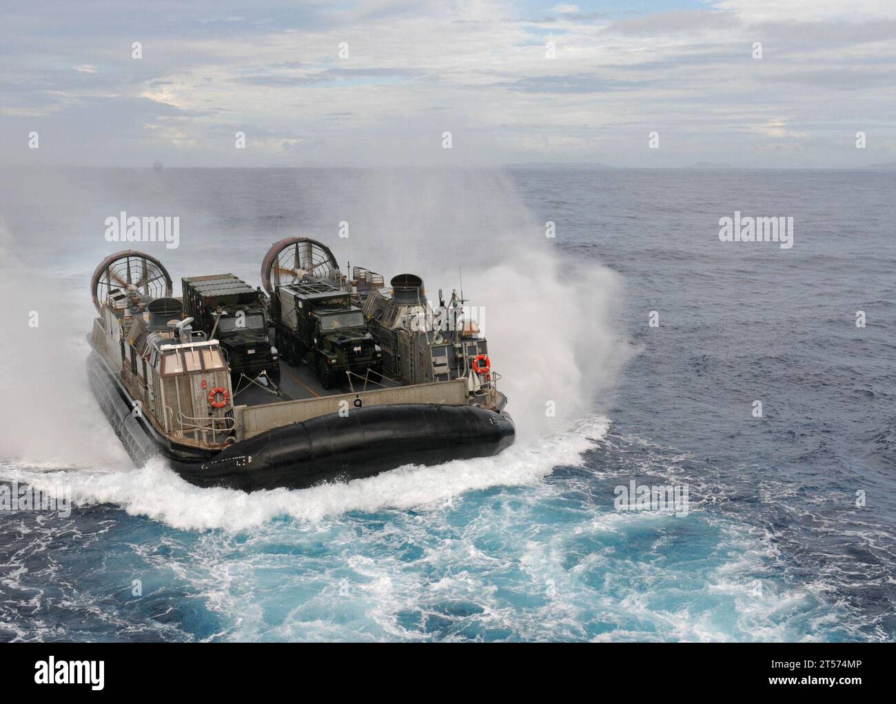 US Navy Landing Craft Air Cushion (LCAC) 9 heads towards the forward ...