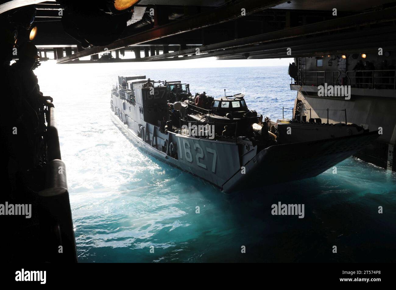 US Navy Landing craft utility (LCU) 1627 departs the well deck of the ...