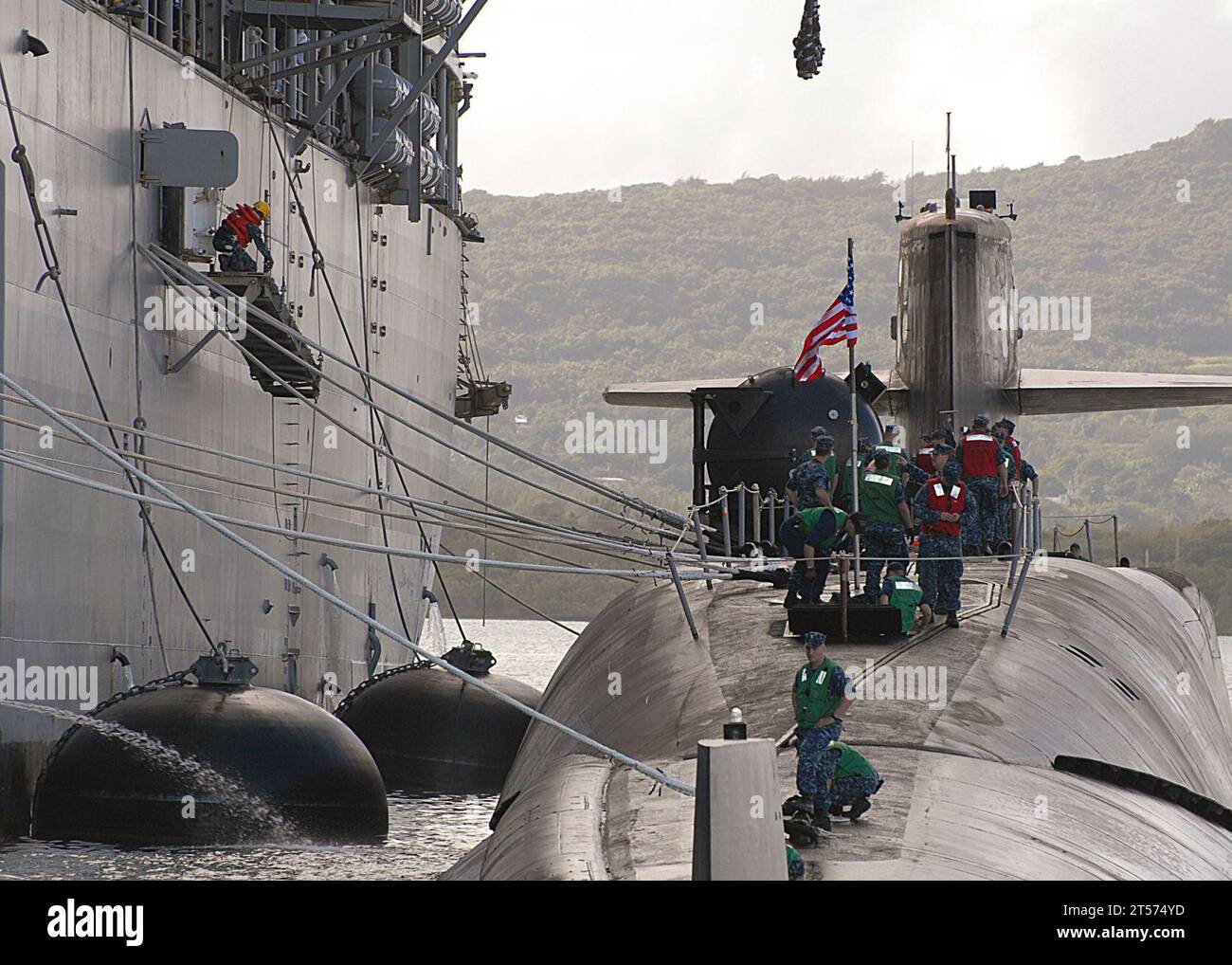 US Navy Line handlers aboard the Ohio-class guided-missile submarine USS Michigan (SSGN 727 ...