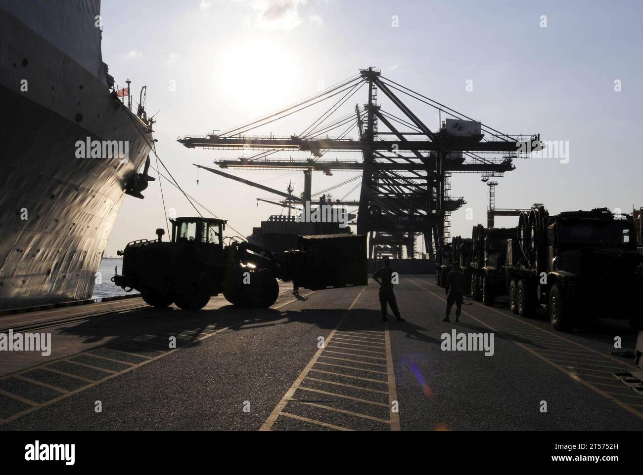 US Navy Marines assigned to Combat Logistics Regiment 3 use a tractor ...