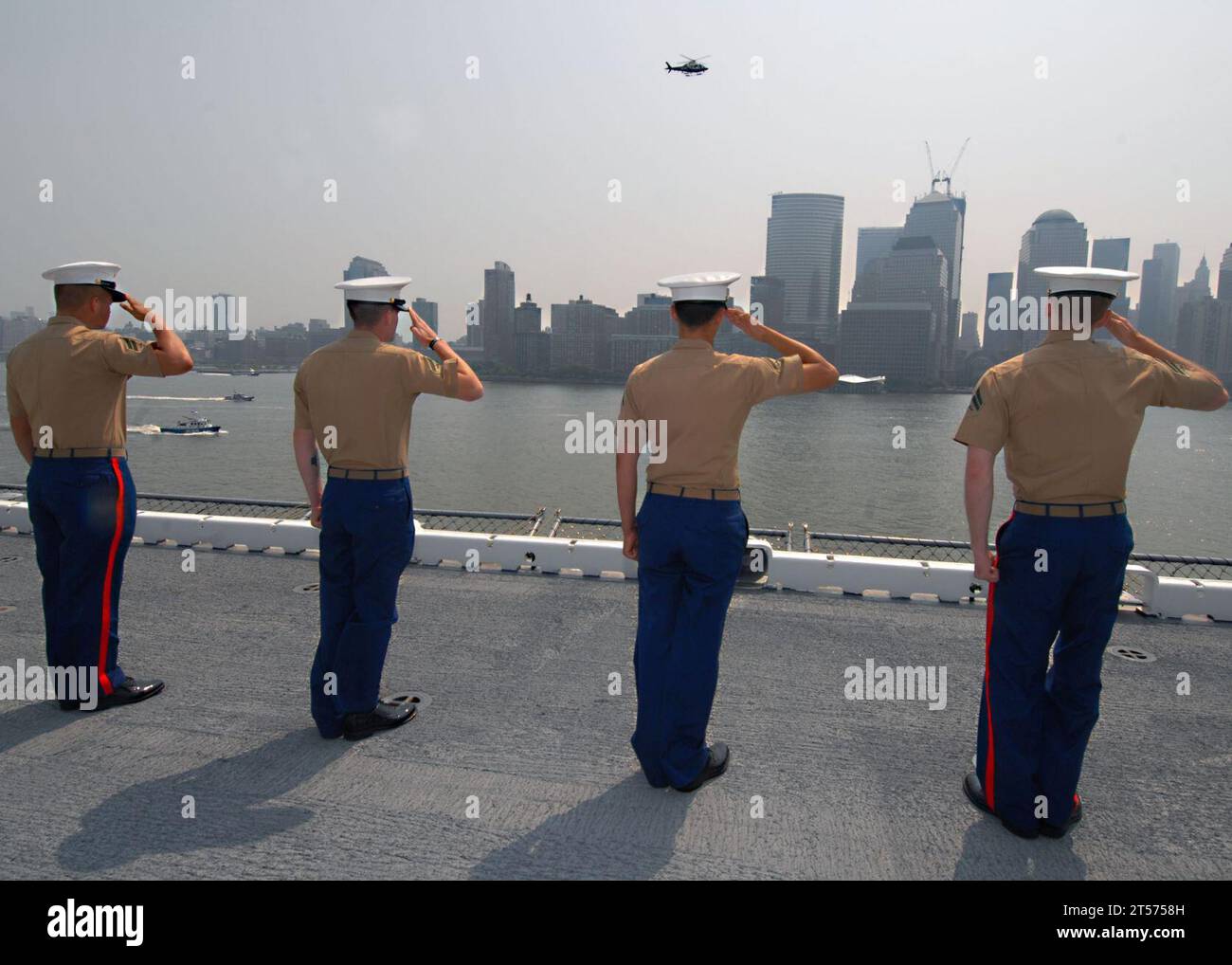US Navy Marines render honors as the multipurpose amphibious assault ...