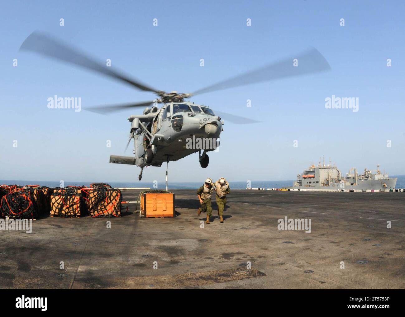 US Navy Marines from the combat cargo department aboard the ...