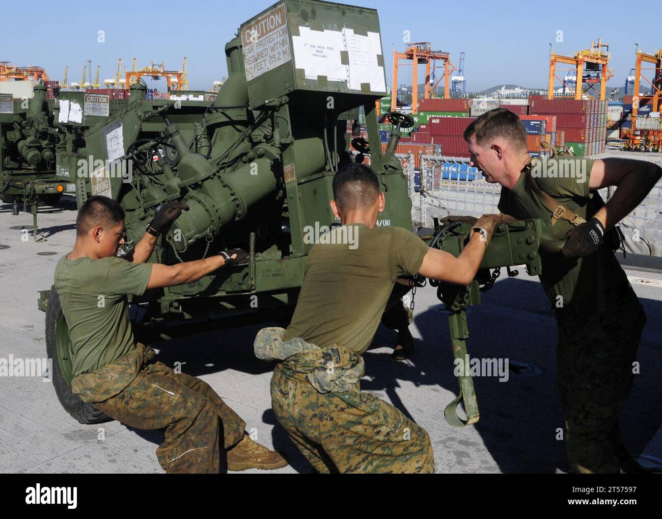 US Navy Marines move a water pump assembly into position.jpg Stock ...