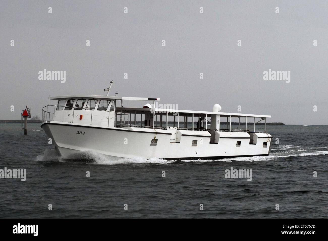 US Navy Newly acquired ferry boat John W. Finn enters the channel to ...