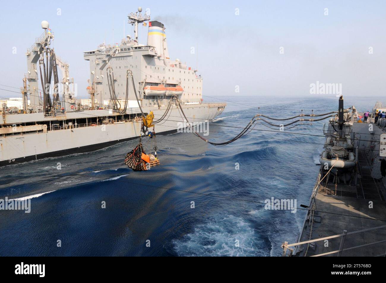 US Navy Pallets of stores are transferred from the Military Sealift ...