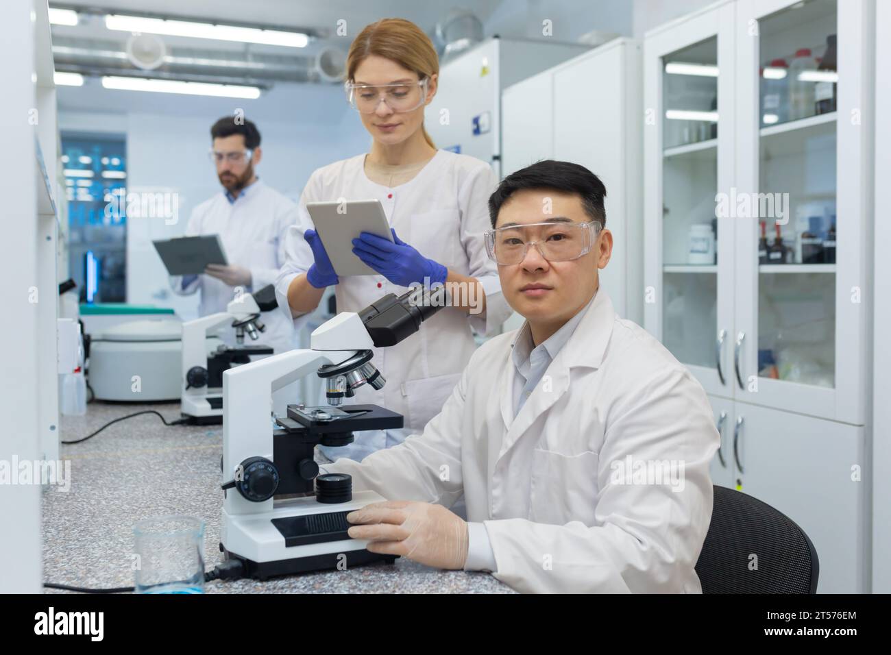 Concentrated mature asian man scientist hi-res stock photography and ...