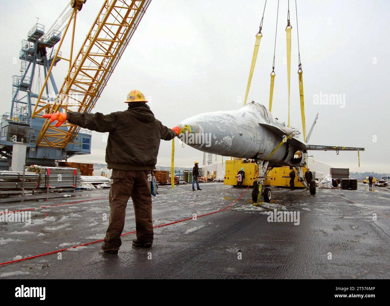 US Navy Puget Sound Naval Shipyard workers and Sailors aboard the Nimitz-class aircraft carrier ...