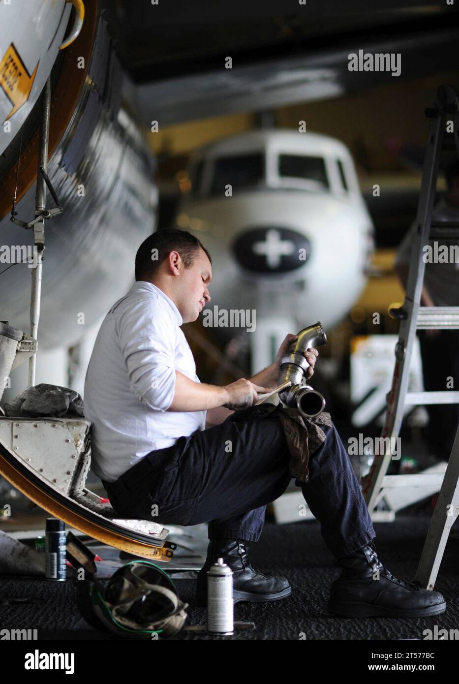 US Navy Sailor performs maintenance on aircraft part.jpg Stock Photo ...