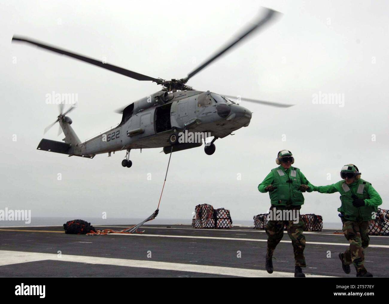 US Navy Sailors aboard George Washington (CVN 73) clear the area as an ...