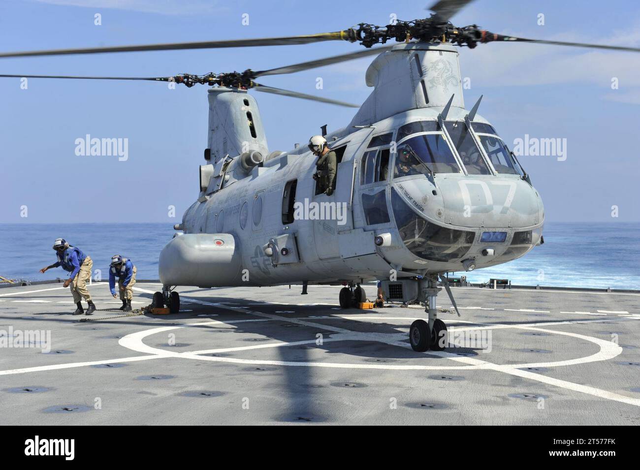 US Navy Sailors aboard the amphibious dock landing ship USS Pearl ...