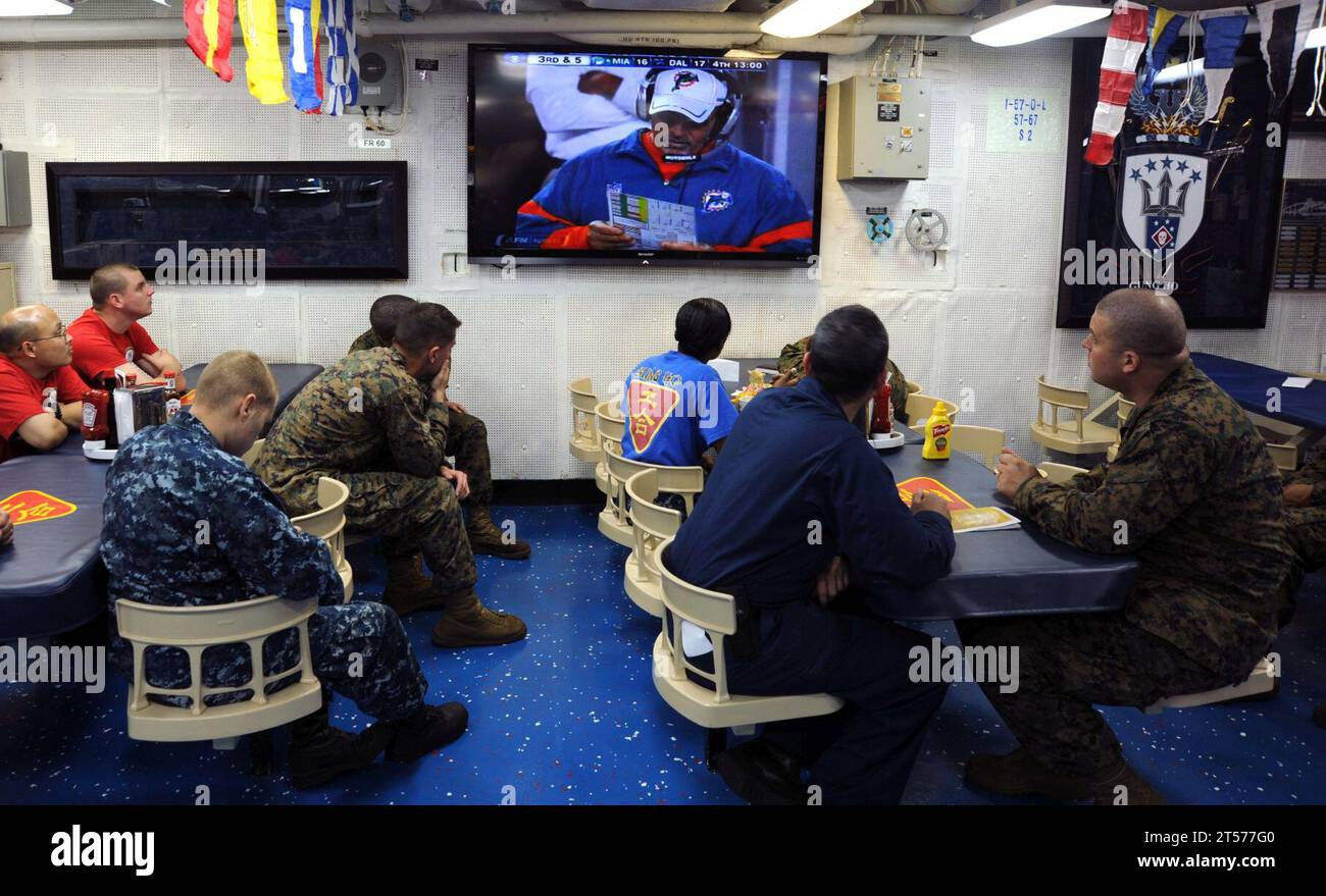 US Navy Sailors aboard the amphibious assault ship USS Makin Island ...