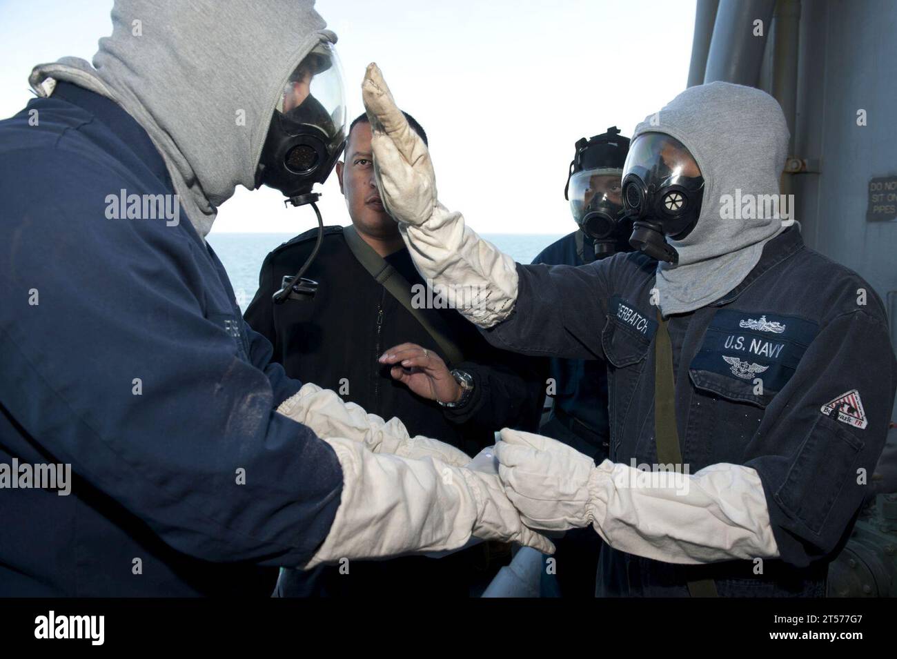 US Navy Sailors aboard the amphibious dock landing ship USS Pearl ...